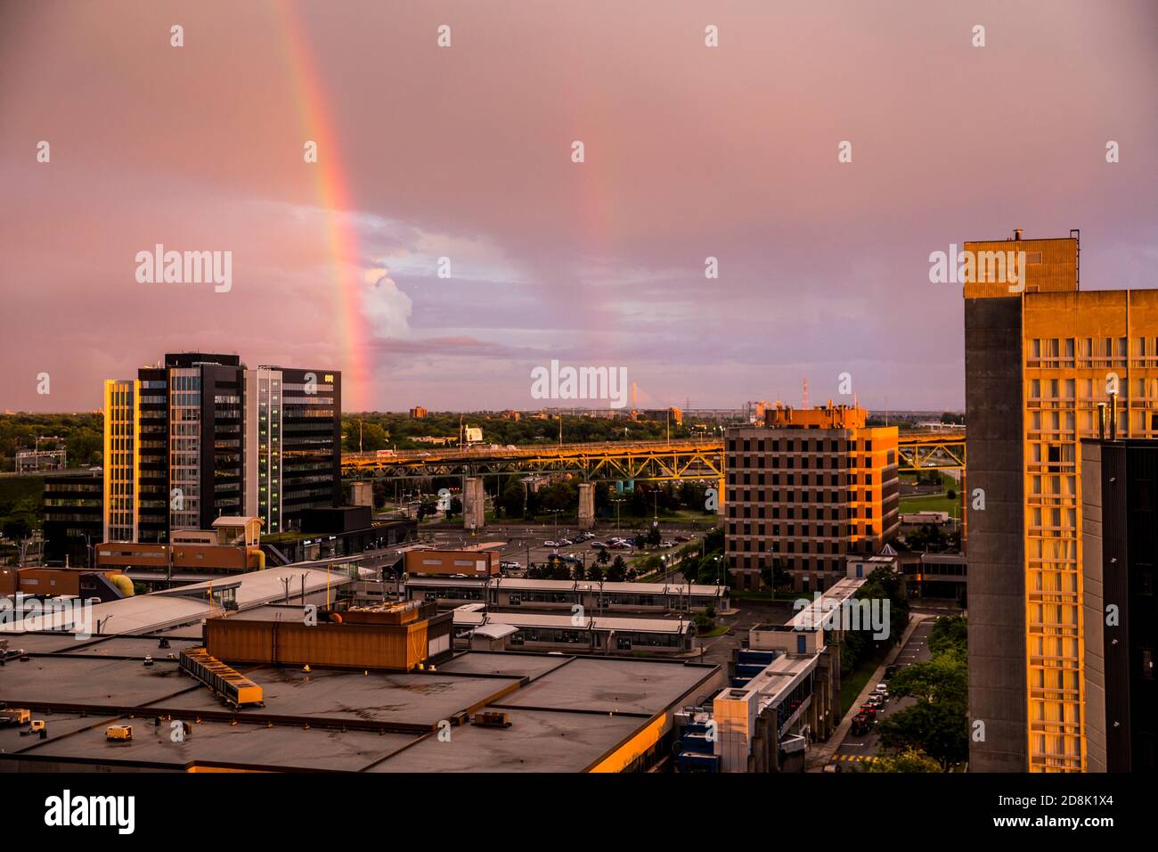 A rainbow over buildings in Longueuil, QC, Canada Stock Photo - Alamy