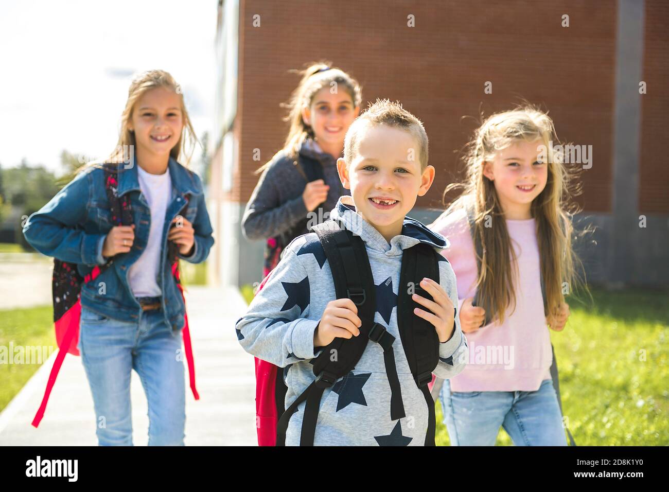 group of kids on the school background having fun Stock Photo - Alamy