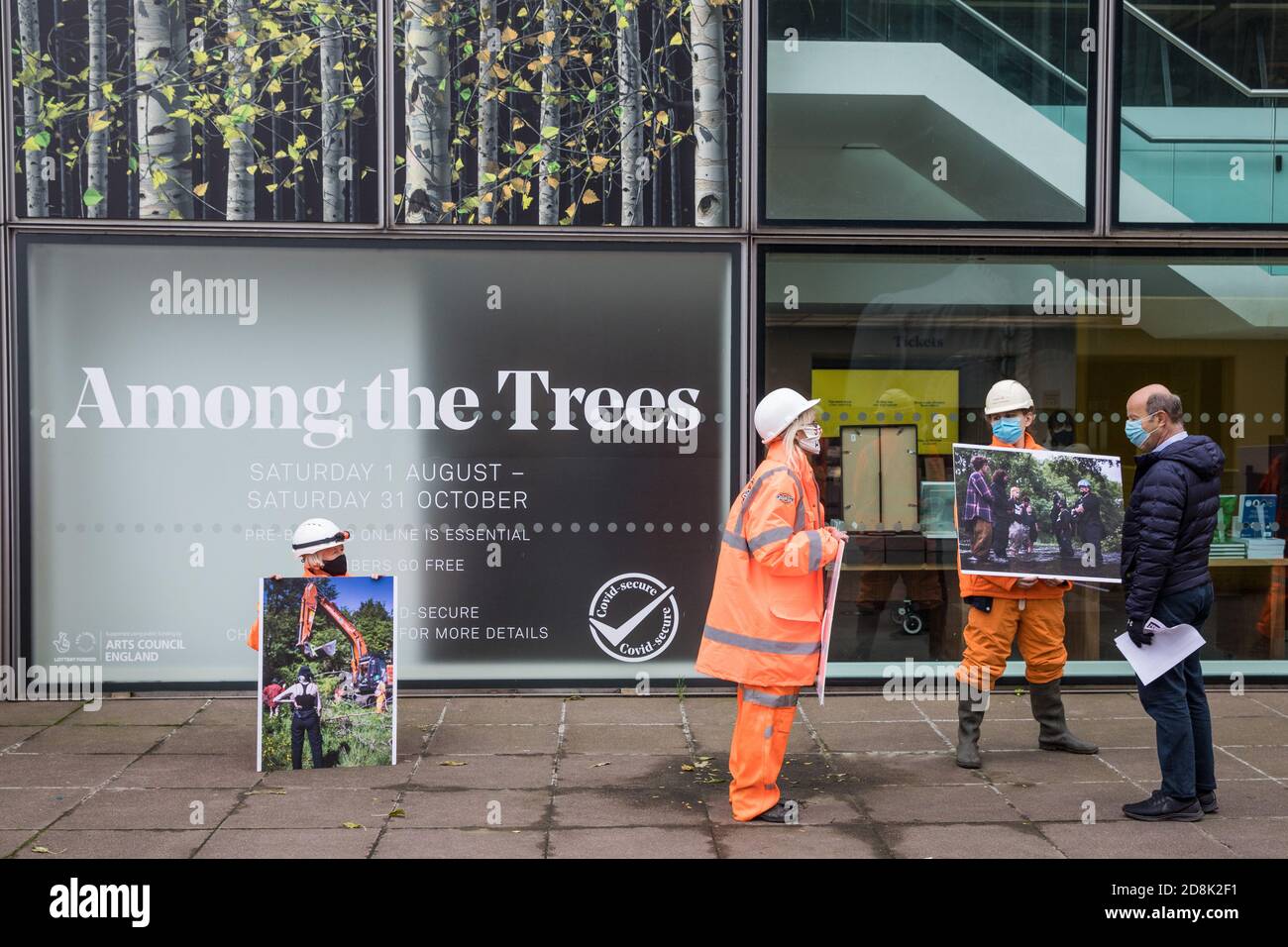 London, UK. 30th October, 2020. Activists dressed as HS2 workers take ...