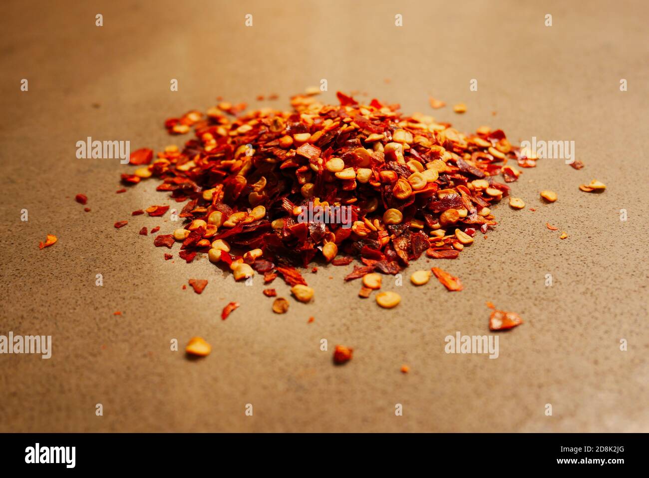 Pile of dried chilli flakes on a kitchen surface Stock Photo - Alamy