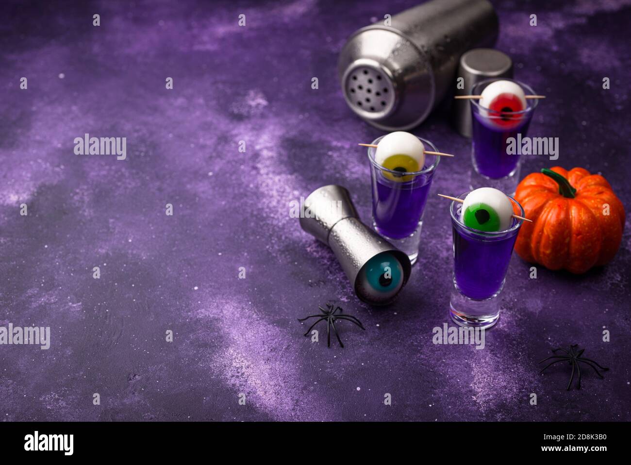 Halloween purple cocktail with eyes Stock Photo - Alamy
