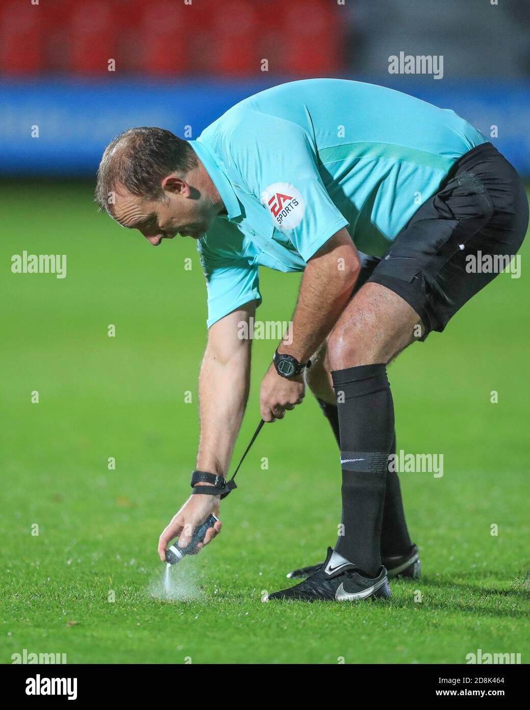 EFL Referee Carl Boyeson marks Southends wall line during a free kick ...
