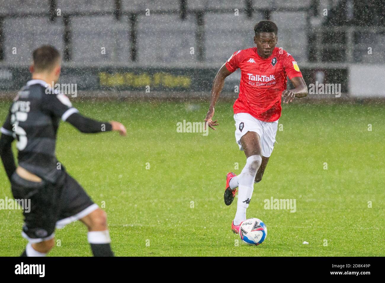 new signing Di’shon Bernard ( 12 ) for Salford City runs with the ball ...