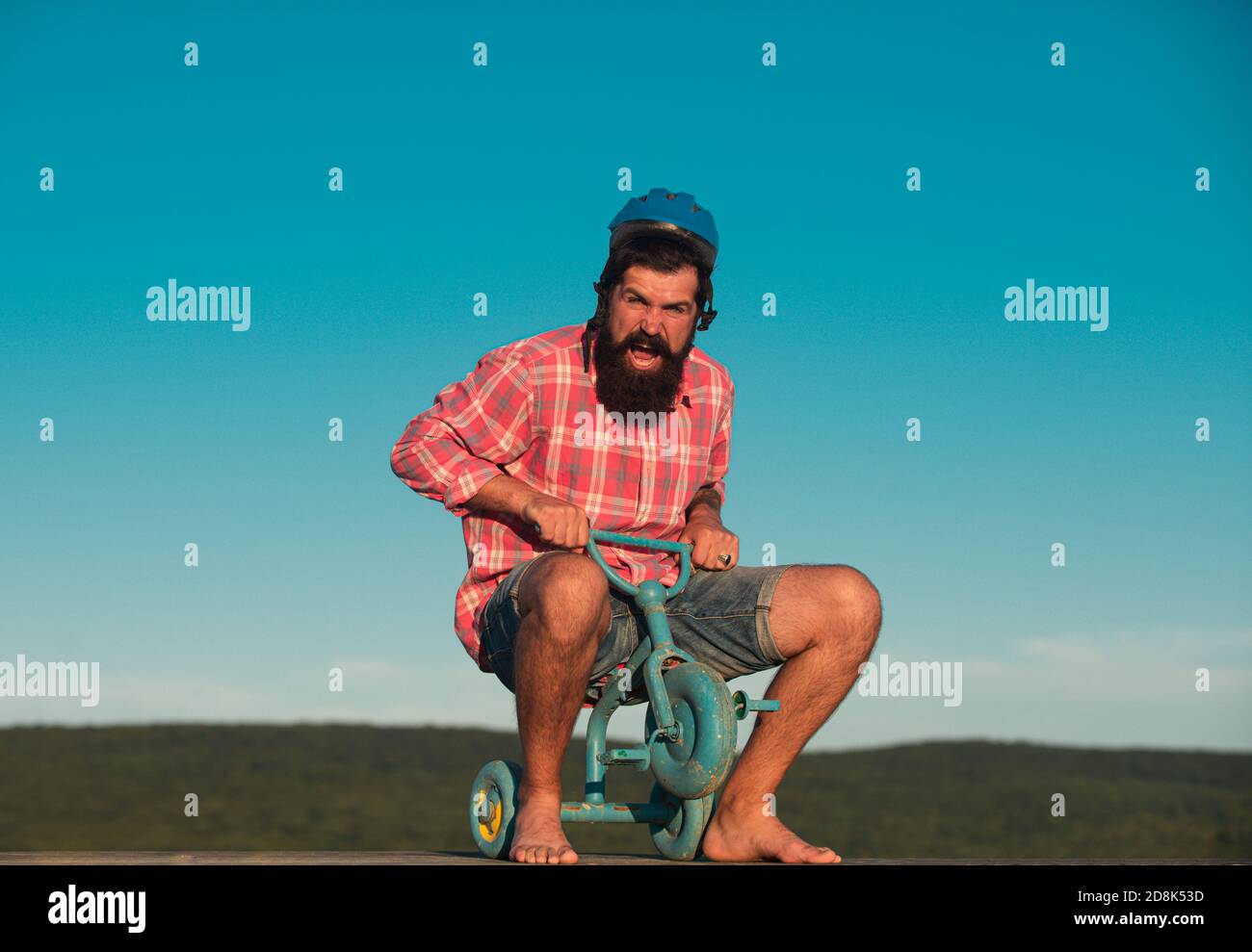 Crazy young man riding a small bike hi-res stock photography and images ...