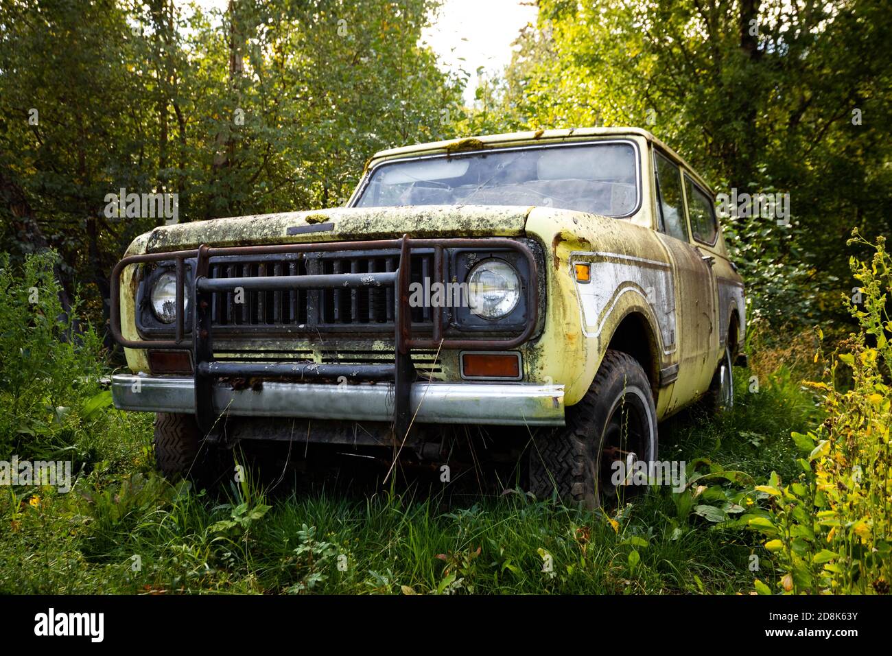 Classic old rusty 4x4 adventure truck in the forest at sunny day Stock ...