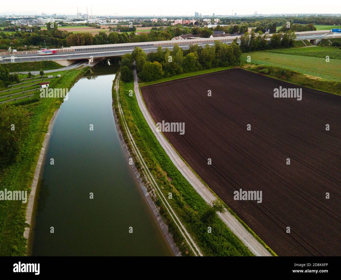 Aerial view of a water canal with a bridge over it Stock Photo - Alamy