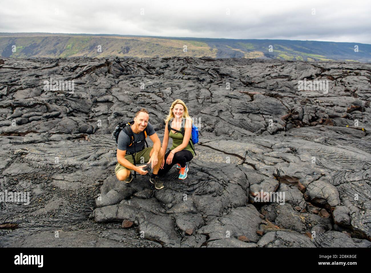 The couple Tourist visiting the lava field at hawaii Stock Photo - Alamy