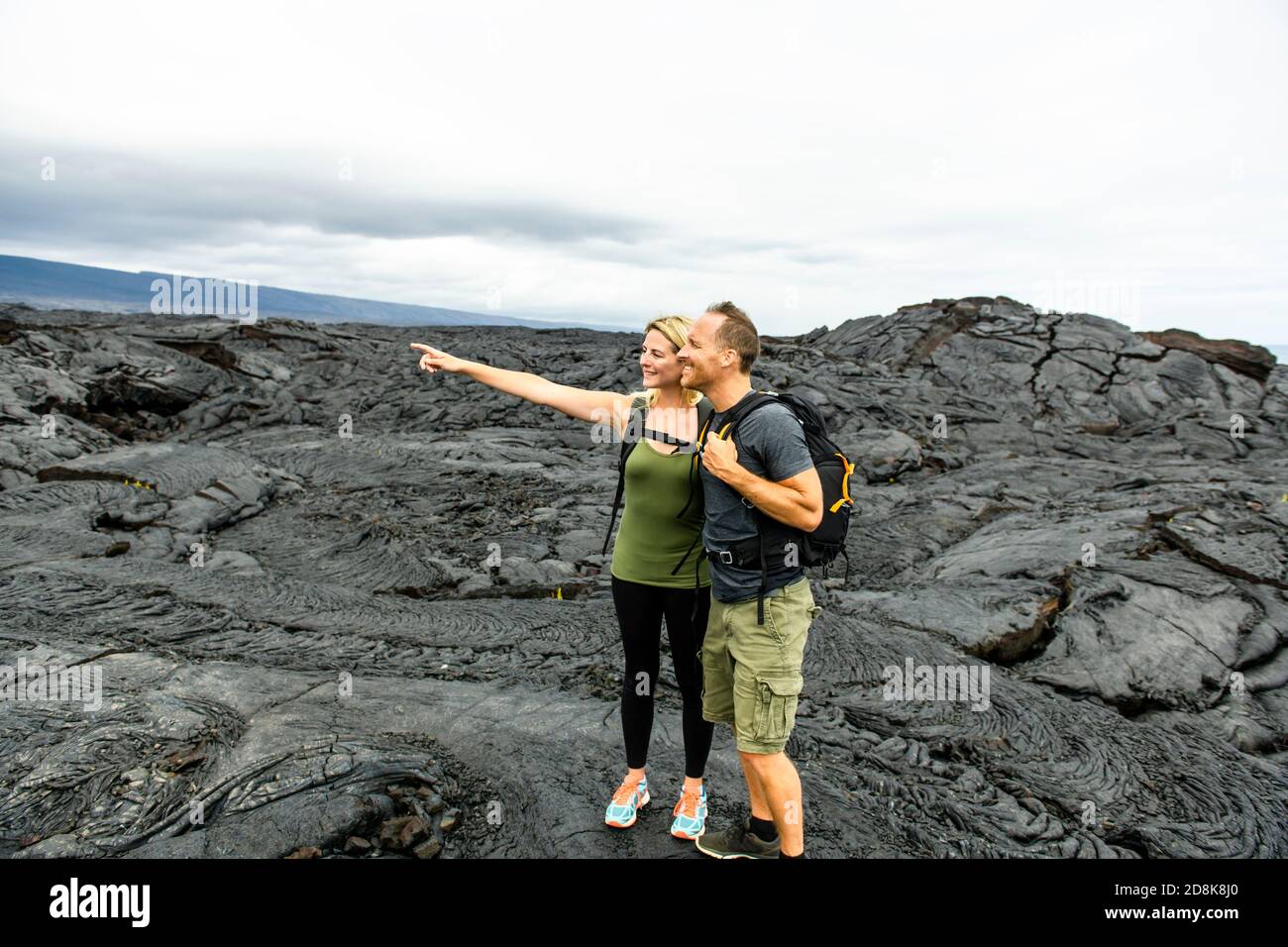 The couple Tourist visiting the lava field at hawaii Stock Photo - Alamy