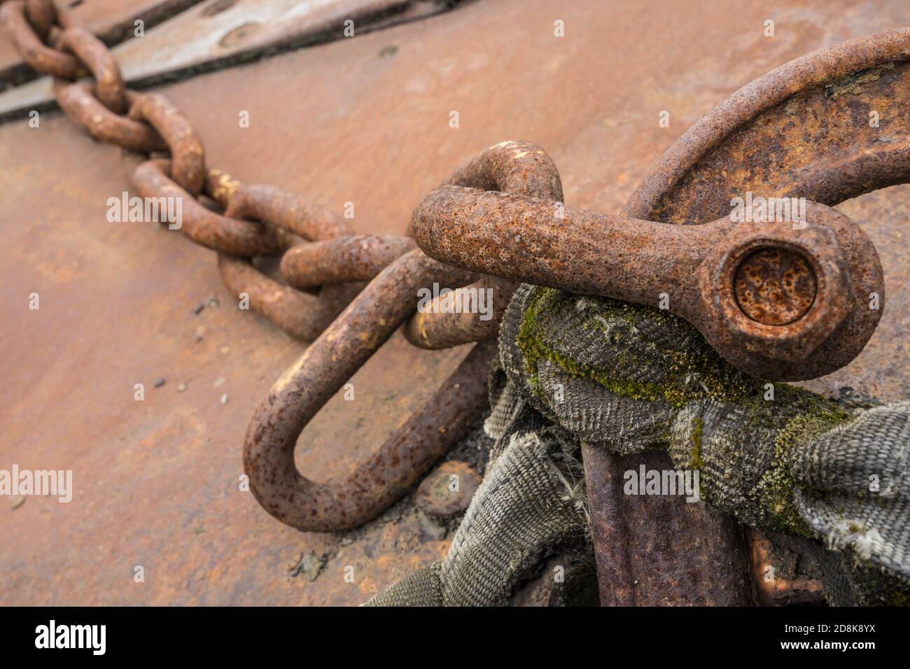 rusty chain on a rusty machine background Stock Photo - Alamy
