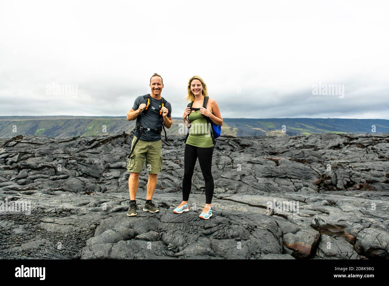 The couple Tourist visiting the lava field at hawaii Stock Photo - Alamy