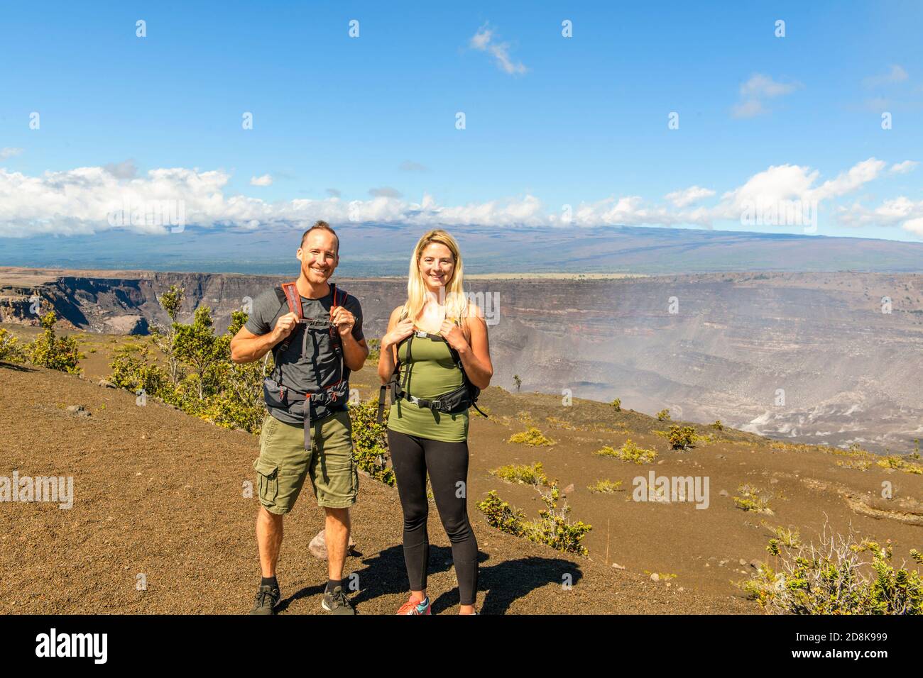 The Hiking couple seeing volcano national park from crater on the ...