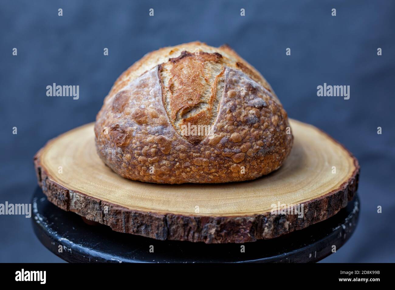 Artisan loaf of traditional Homemade sourdough Boule bread with crust ...