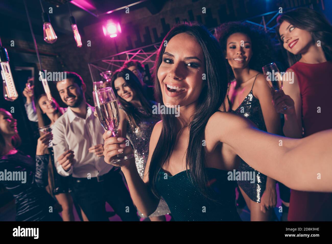 Self photo portrait of happy woman holding champagne glass at prom ...
