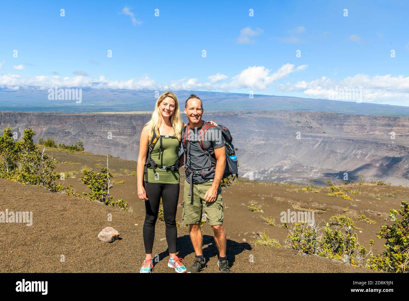 The Hiking couple seeing volcano national park from crater on the ...
