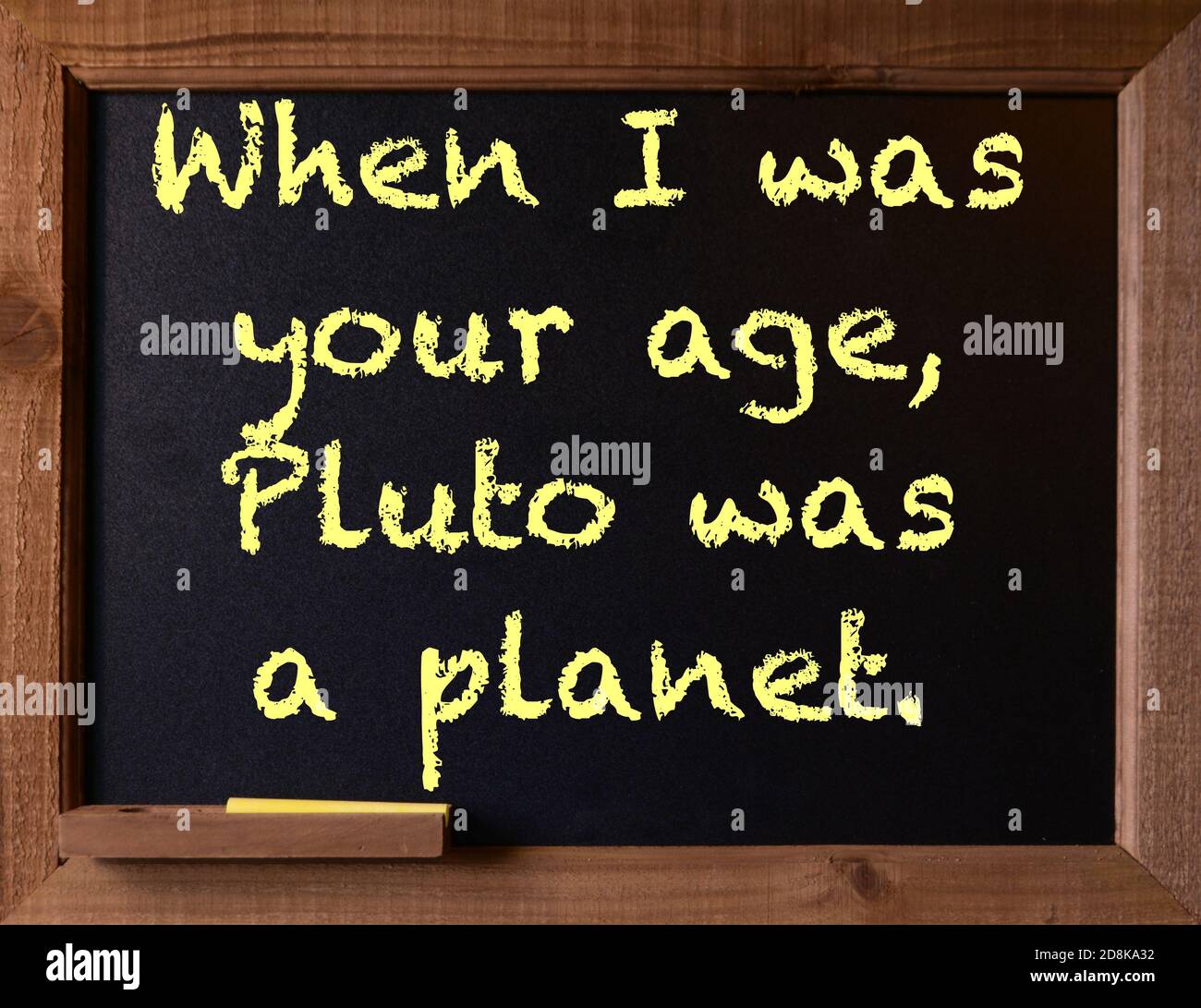 Blackboard with a quip about age and Pluto, when I was your age Stock ...