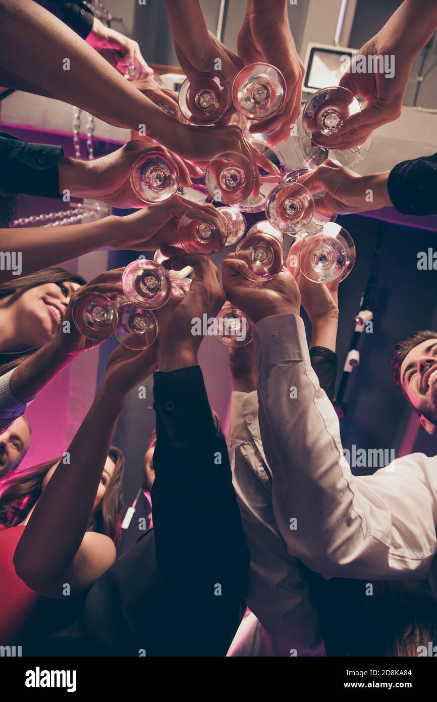 Vertical cropped concept photo portrait low below angle of people ...