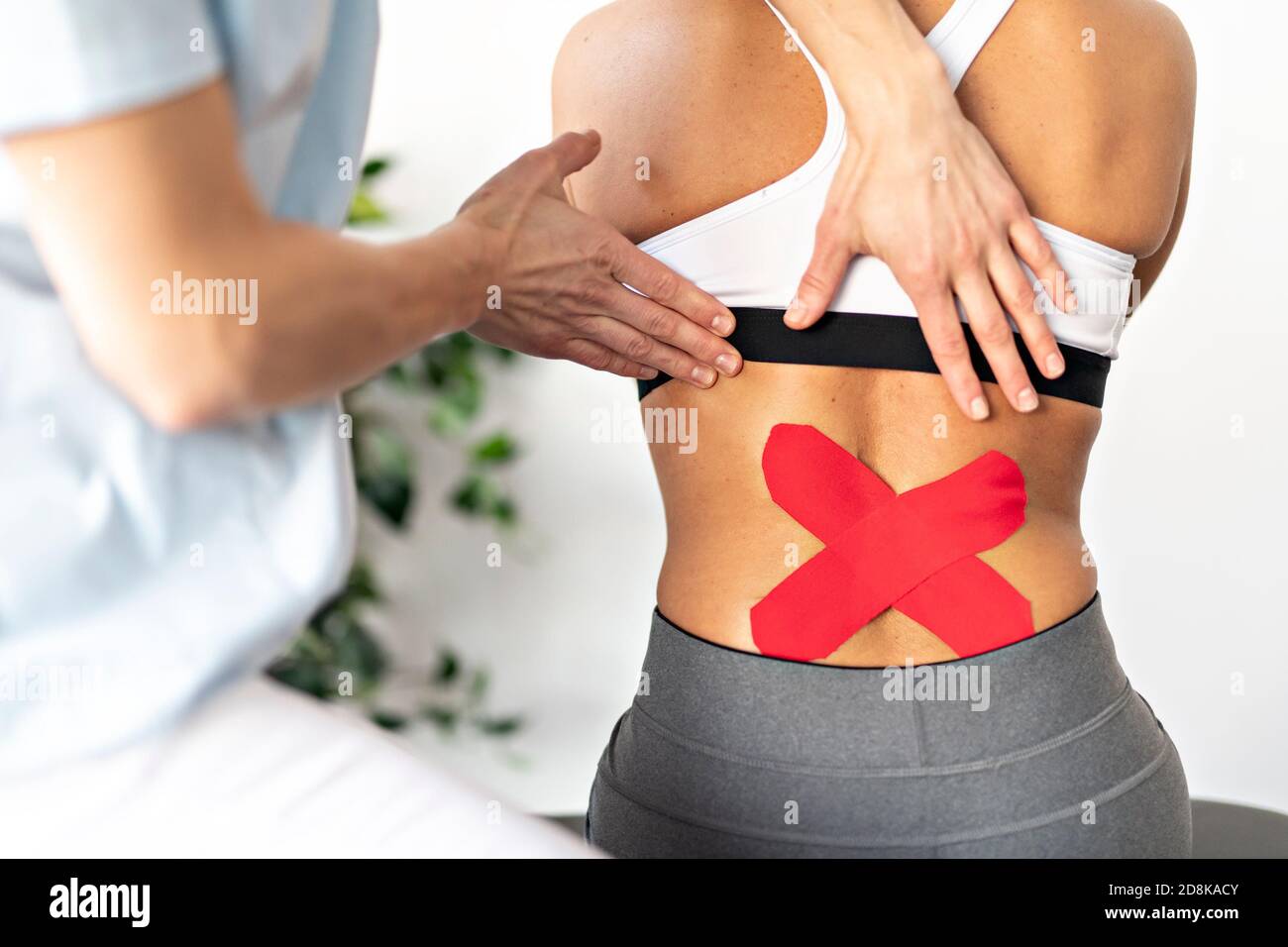 A Modern rehabilitation physiotherapy worker with woman client Stock ...