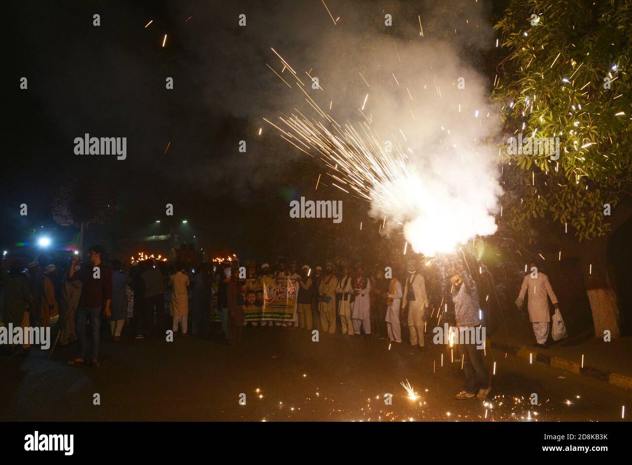 Pakistani muslims youth hold torch lights during a rally ahead of ...