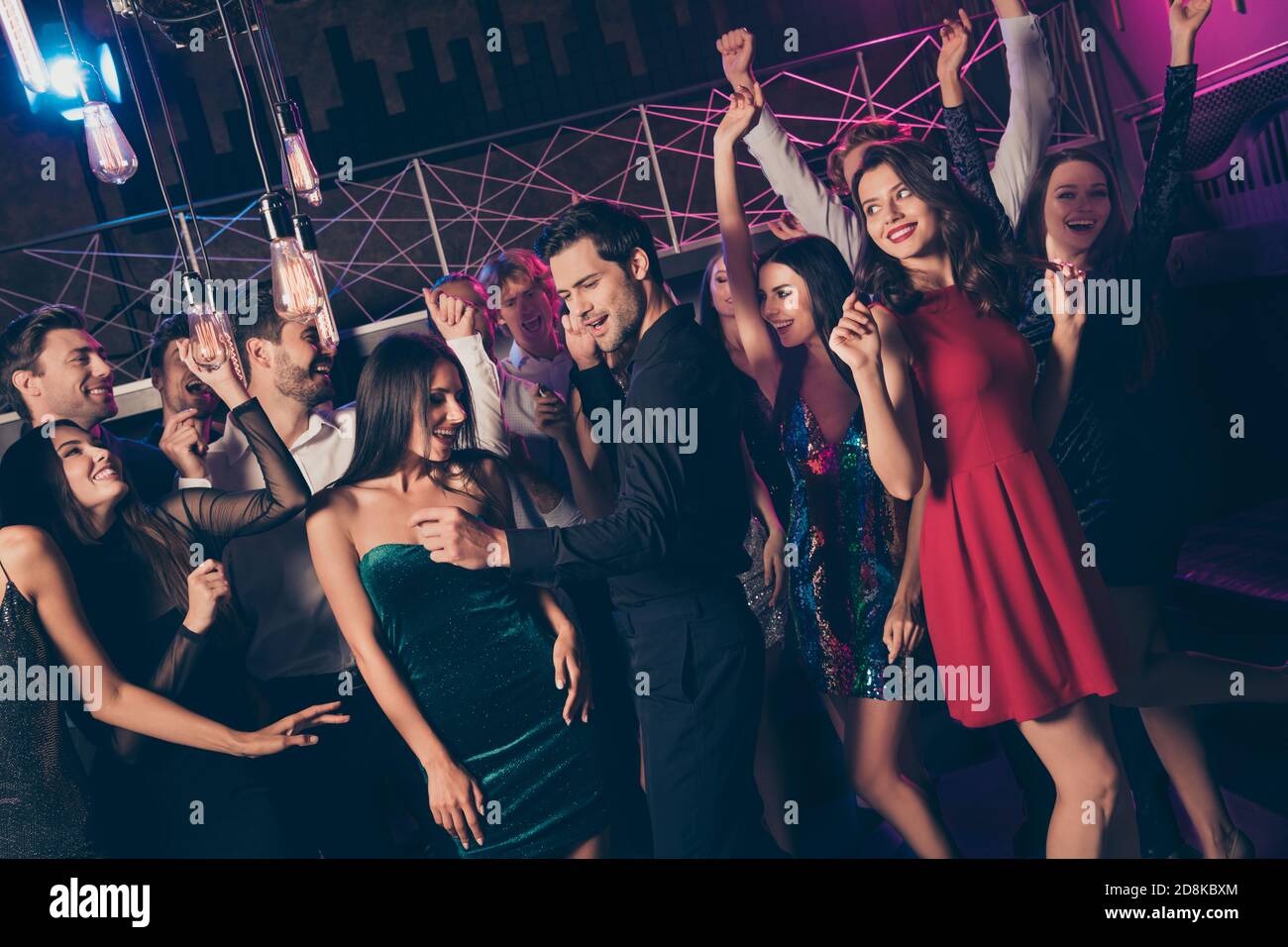 Photo portrait of cute couple dancing at party with other people Stock ...