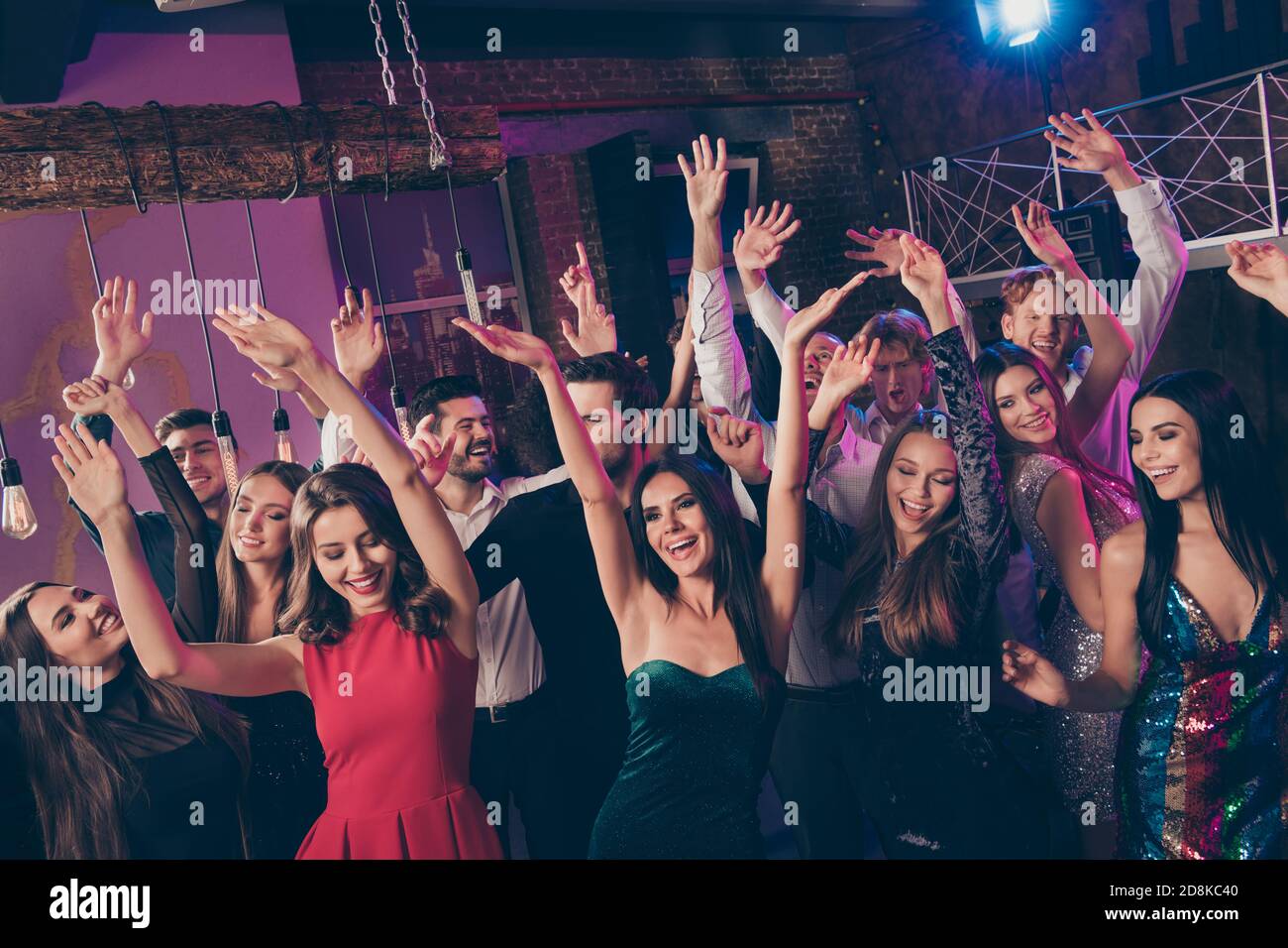 Photo portrait of people raising hands dancing screaming at nightclub ...