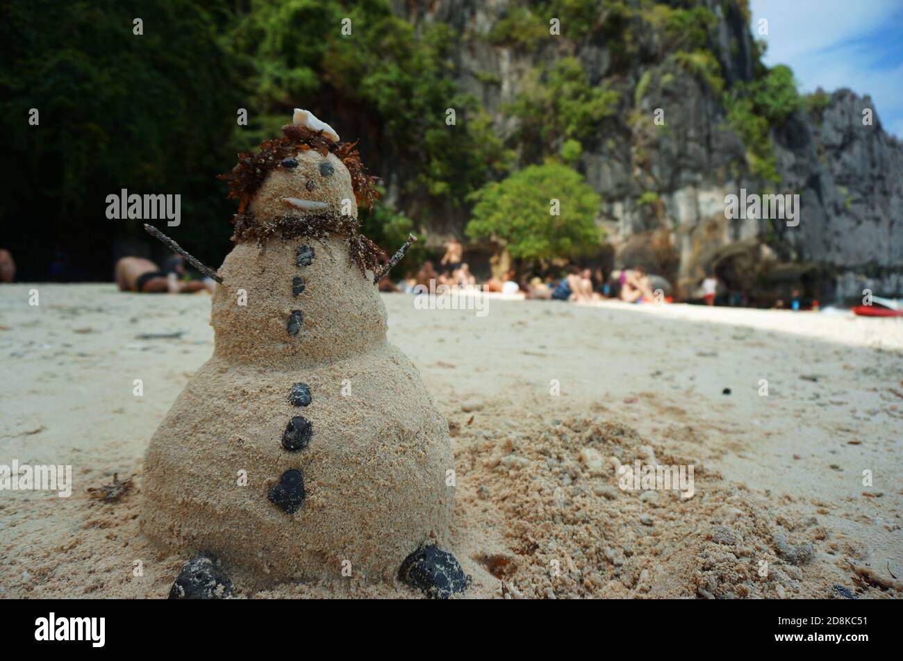 Happy sandman with black pebbles and waterplants Stock Photo - Alamy