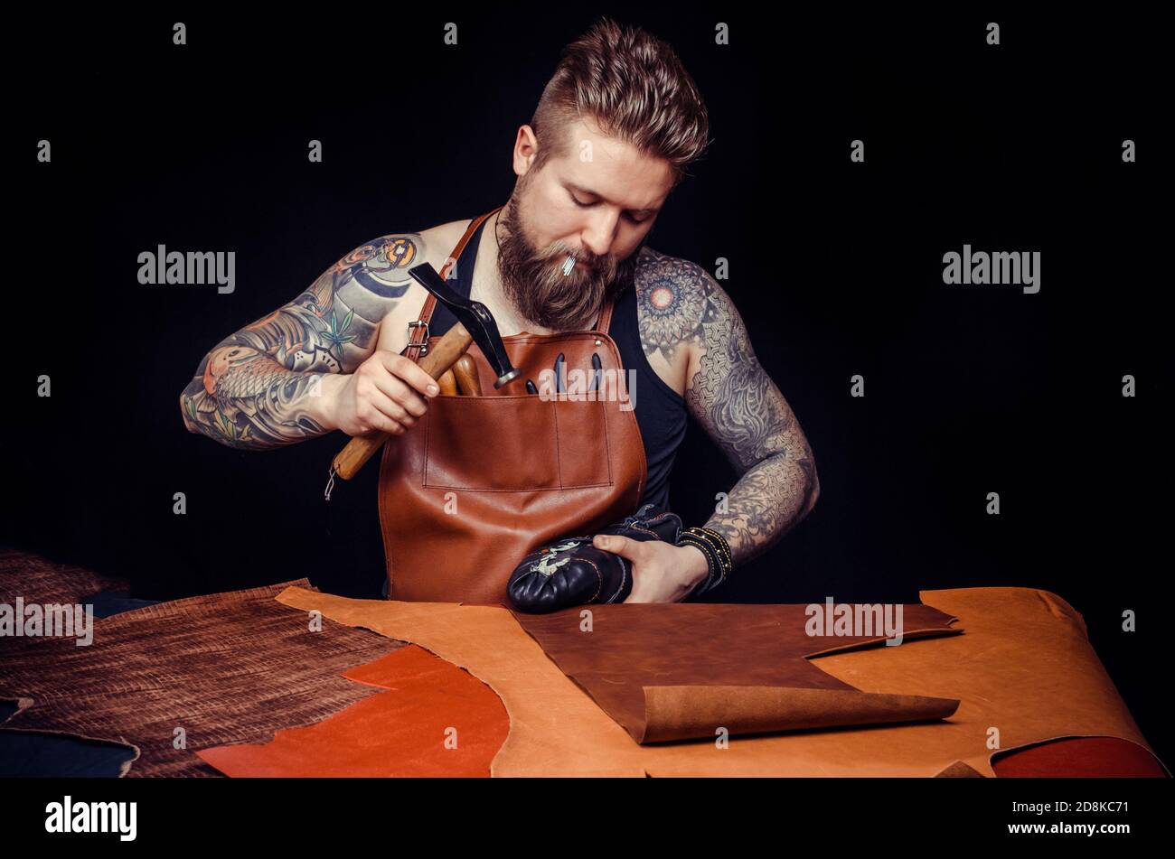 Leather Craftsman working with leather in the workshop Stock Photo - Alamy