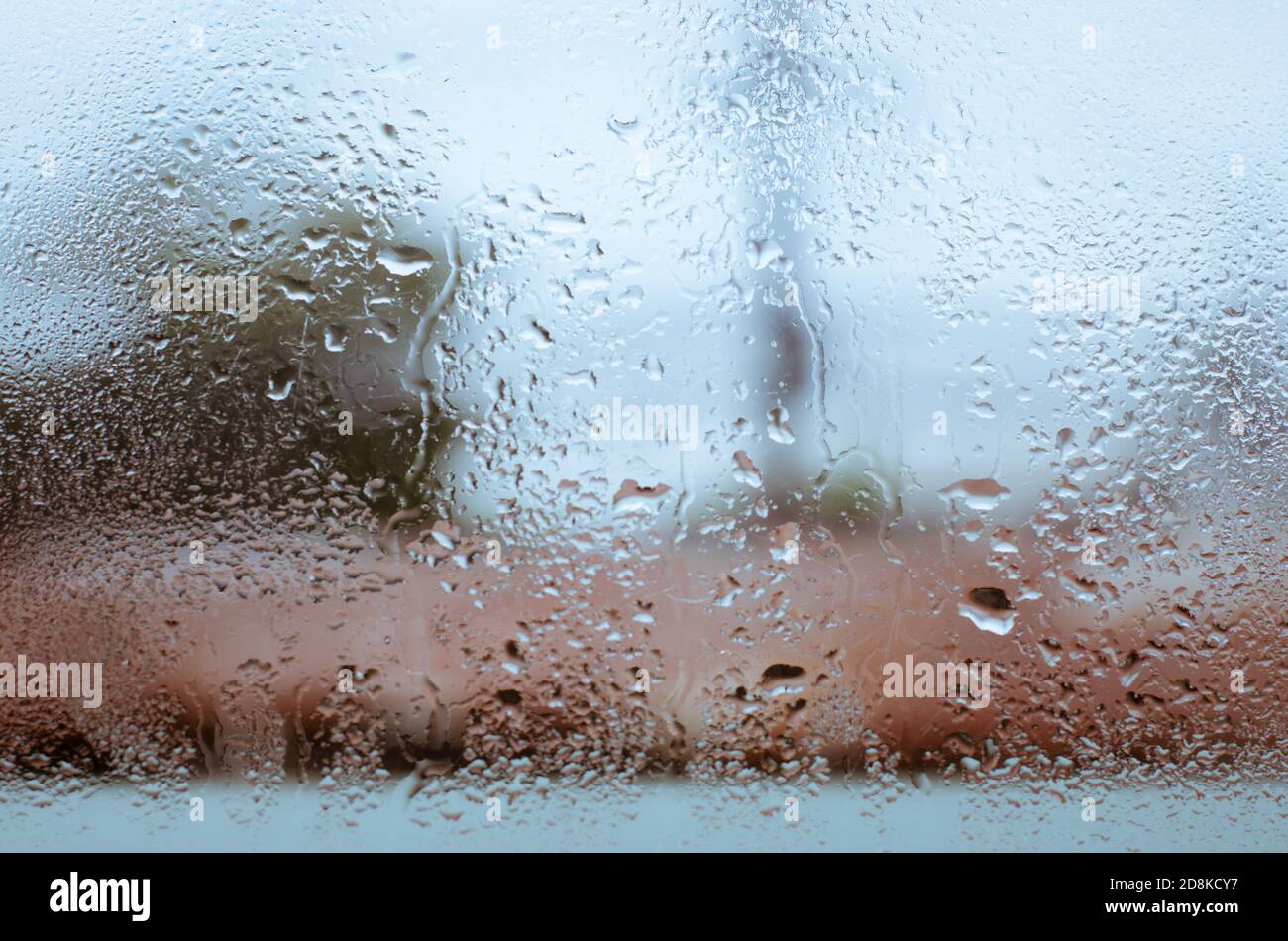 Raindrop Falling Down on the Window Glass for Blurry Background Stock ...
