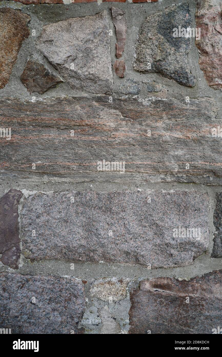 Vertical shot of a cobblestone wall texture Stock Photo - Alamy