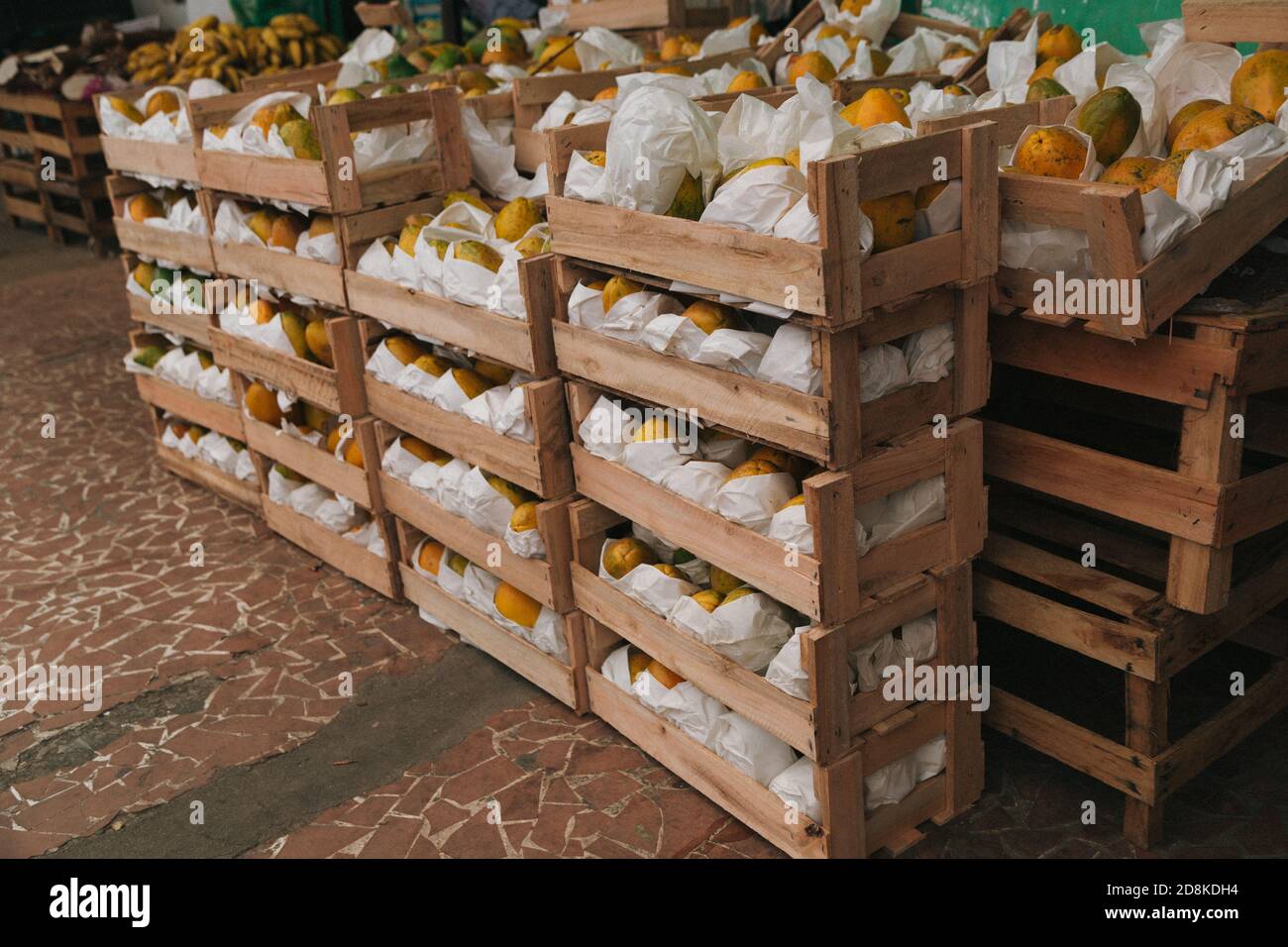 Stack of wooden boxes with papaya Stock Photo - Alamy