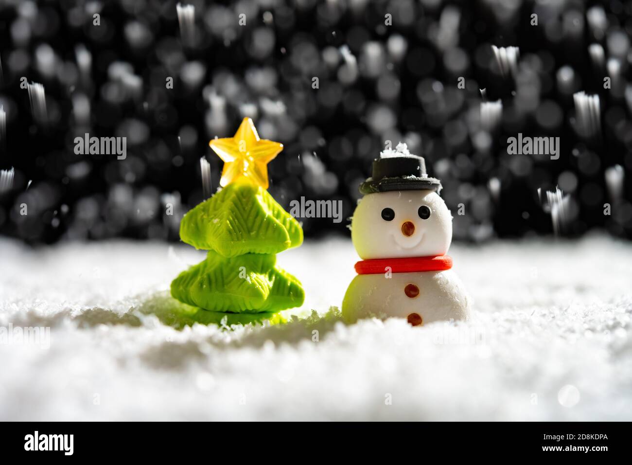 Snowman and tree in snowfall hi-res stock photography and images - Alamy
