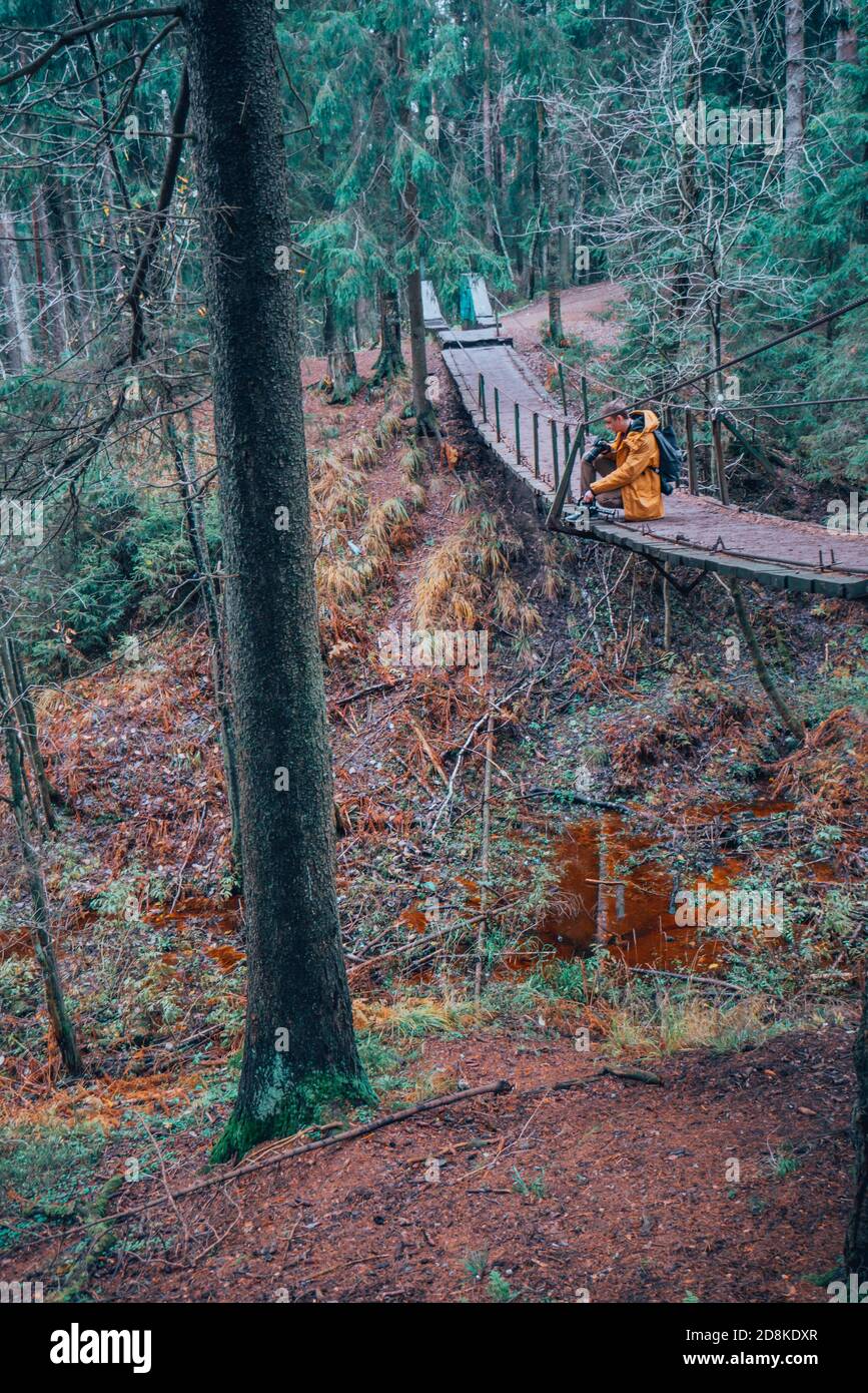 Man walking suspension bridge hi-res stock photography and images - Alamy