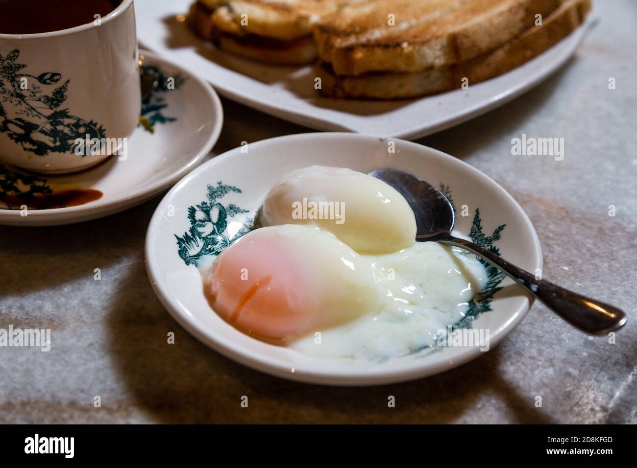 Half boiled eggs, coffee, toast bread, popular Chinese style breakfast in Malaysia Stock Photo ...
