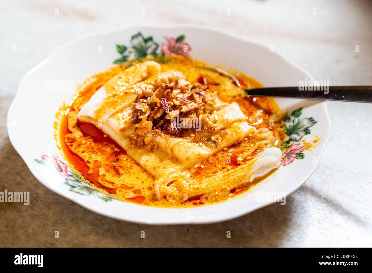 Serving of curry chee cheong fun, popular breakfast in Malaysia among ...