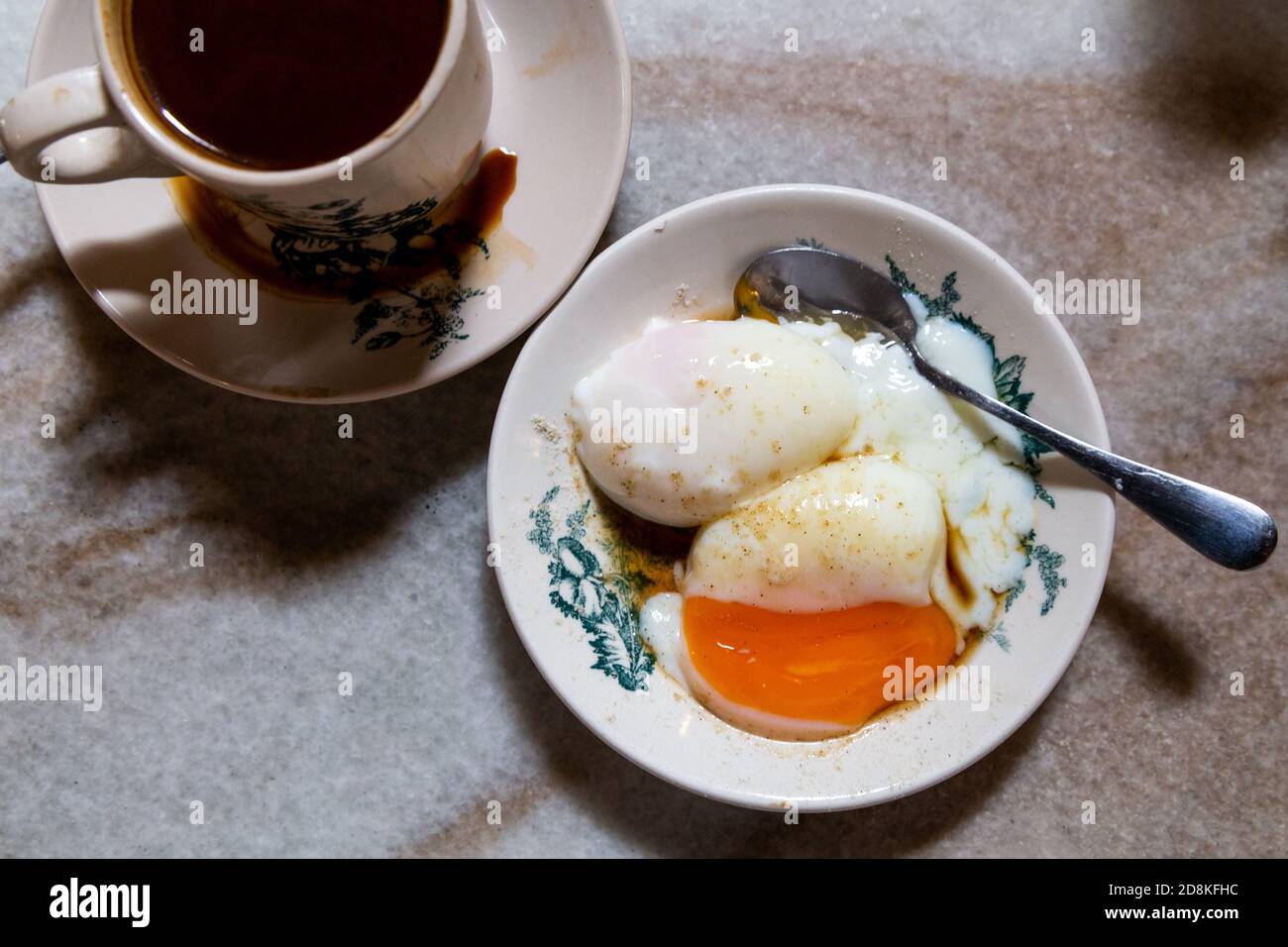 Half boiled eggs and coffee, popular and nutritious Chinese style breakfast in Malaysia Stock ...