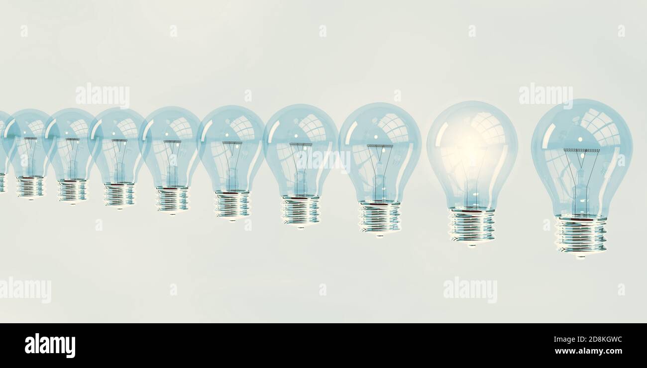 Smart Solutions with Single Lit Light Bulb Stock Photo - Alamy