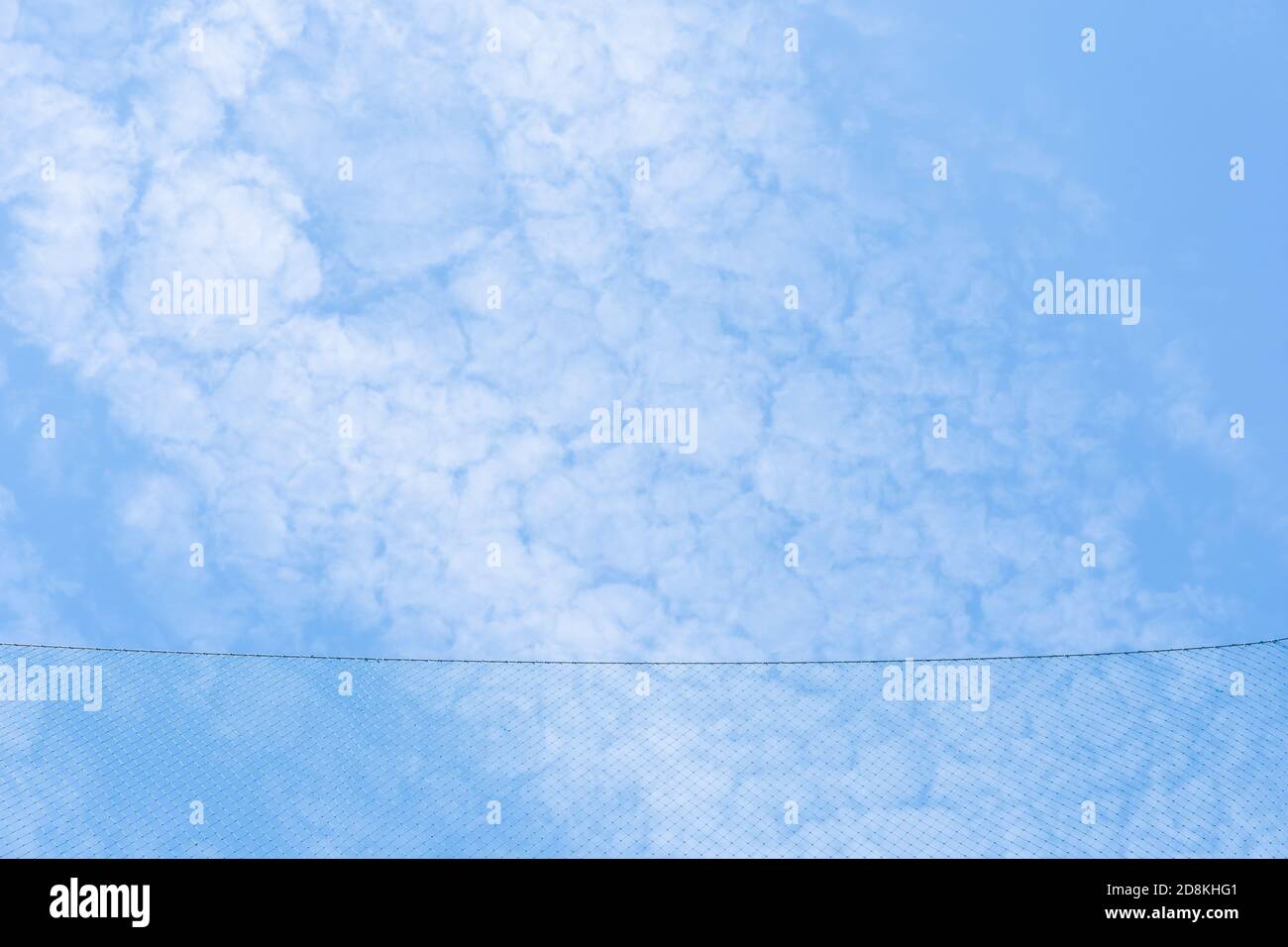 net mesh grid and blue sky background Stock Photo - Alamy