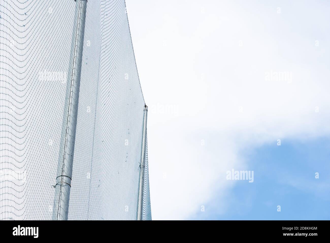 net mesh grid and blue sky background Stock Photo - Alamy
