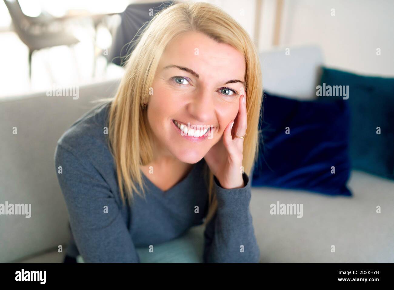 Relaxed woman enjoying rest on comfortable sofa, calm attractive girl ...