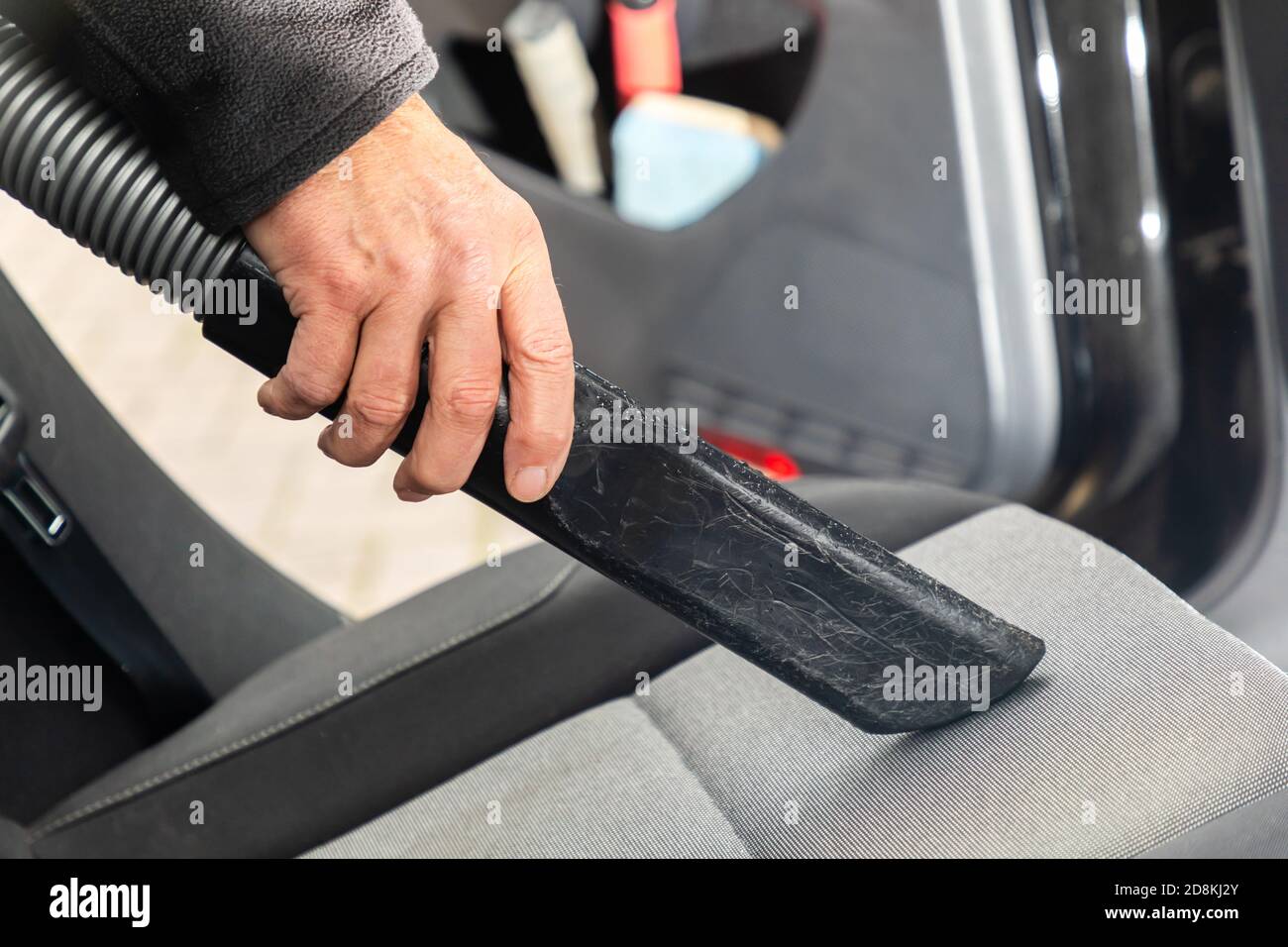 Closeup of a male hand cleaning car with a sucker Stock Photo - Alamy