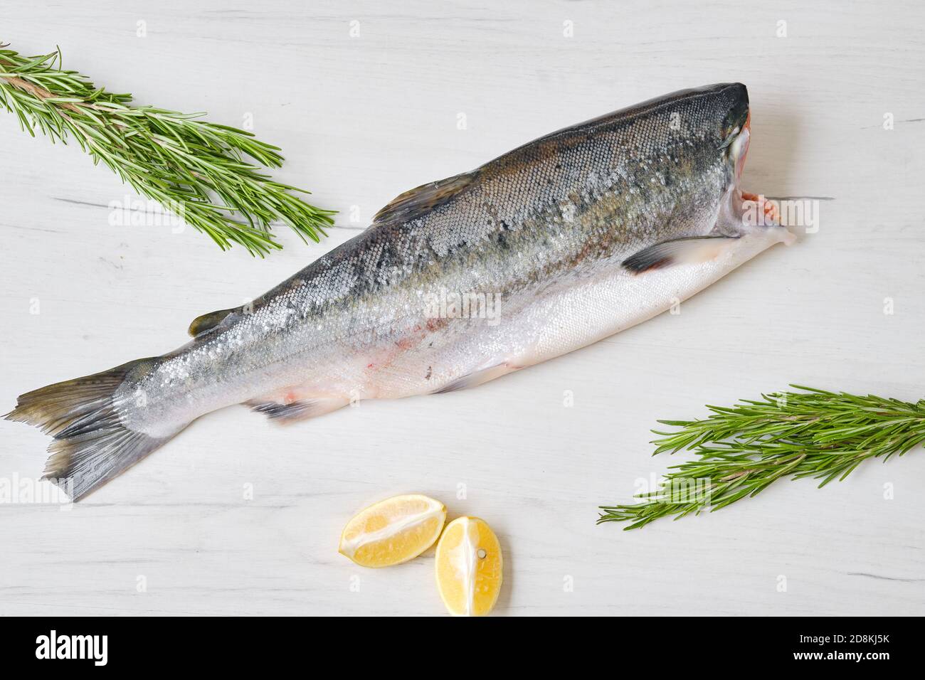 Fresh frozen headless loach on black background Stock Photo - Alamy