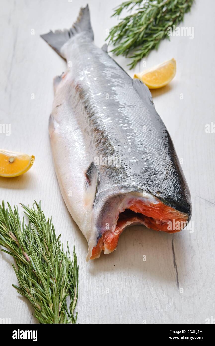 Fresh frozen headless loach on black background Stock Photo - Alamy
