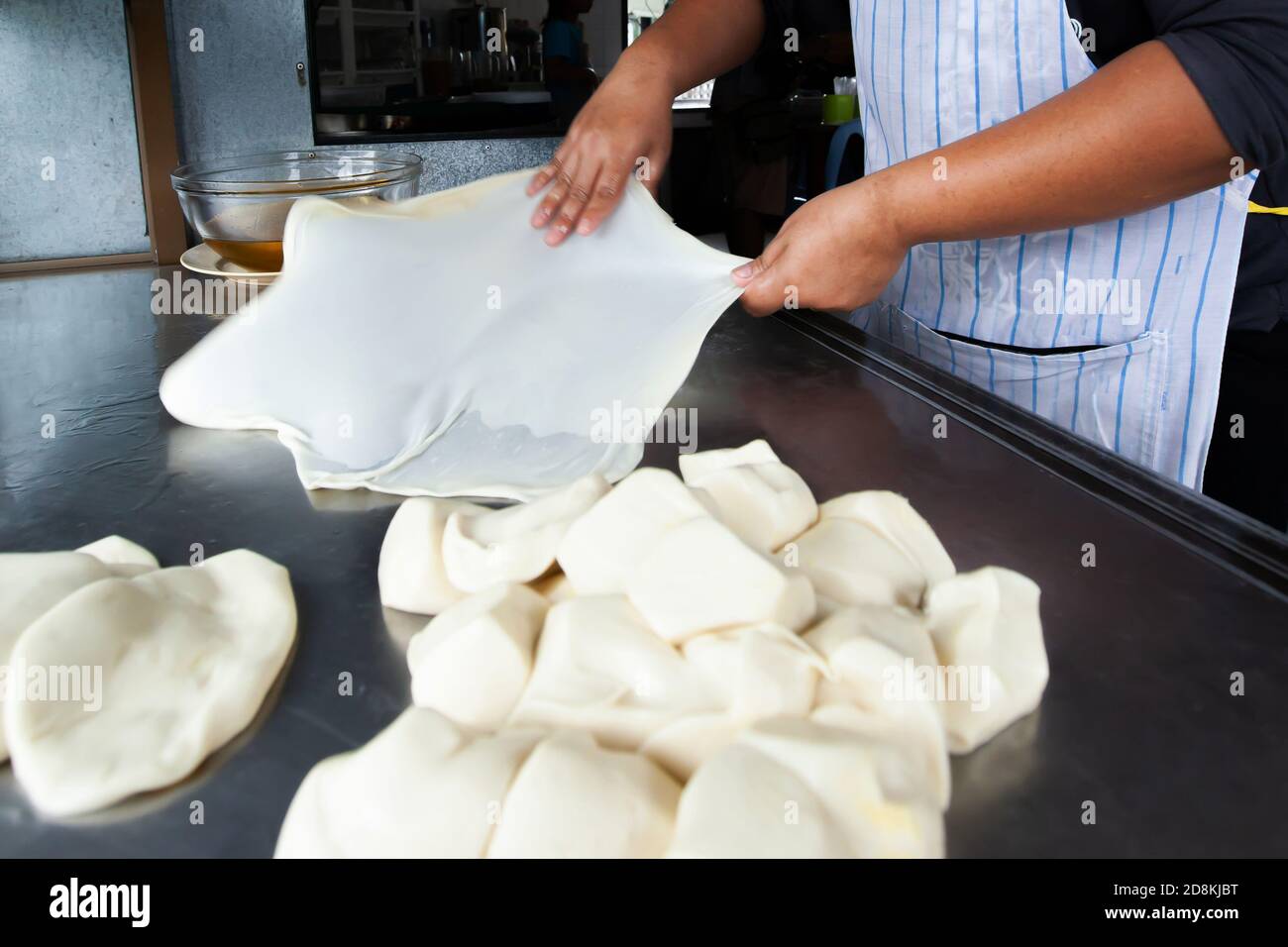 Indian woman cooking making roti hi-res stock photography and images ...