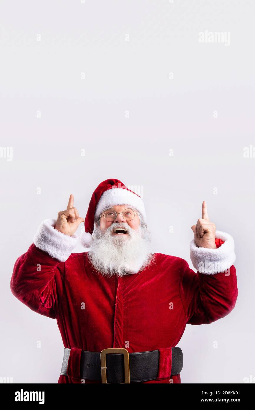 Happy Santa Claus, pointing up in white background Stock Photo - Alamy