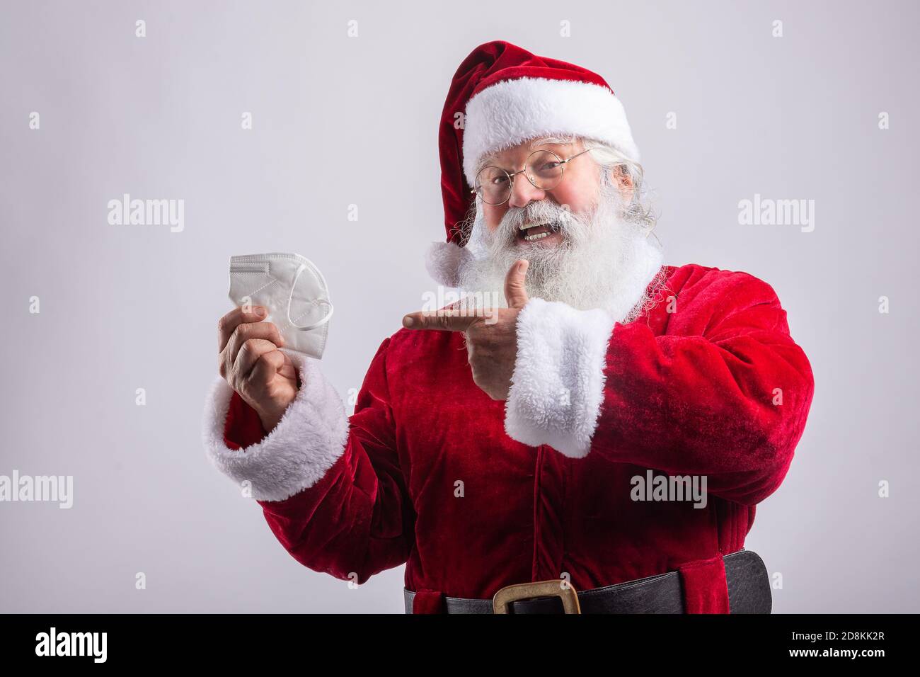 Happy Smart Santa Claus, pointing a mask in white background Stock ...