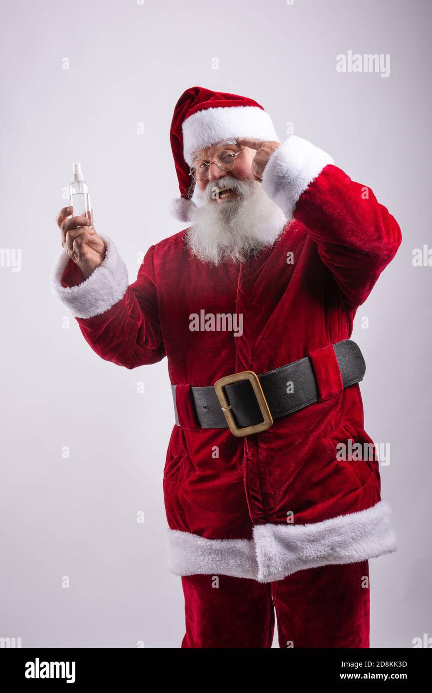 Smart Santa Claus, pointing bottle of hydroalcoholic gel in white ...