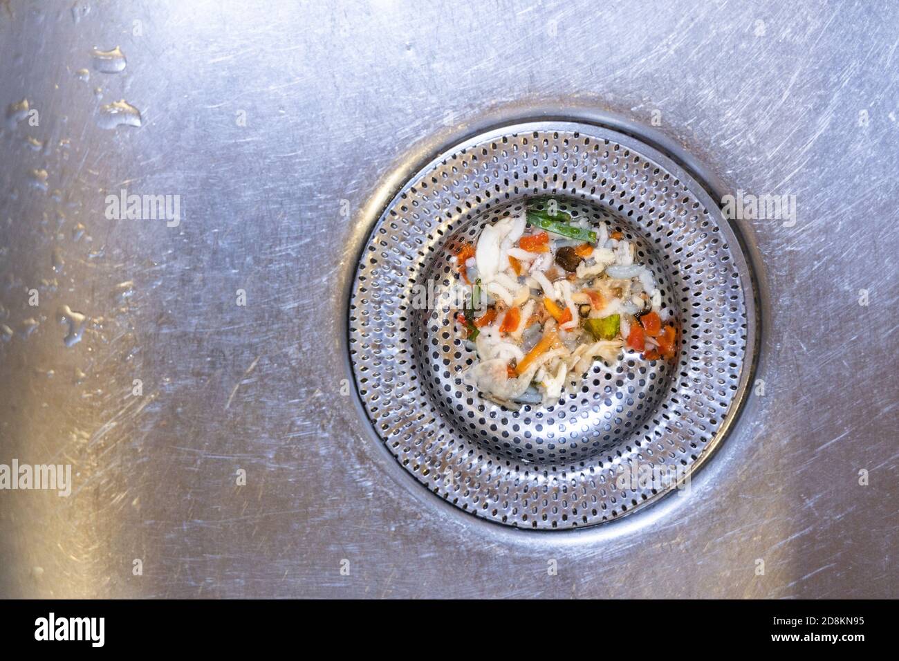 Kitchen sink waste filter trapped waste from flowing into drainage ...