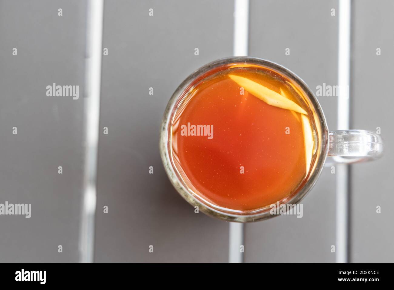 Black tea with ginger slice or known as Teh O Halia Stock Photo - Alamy