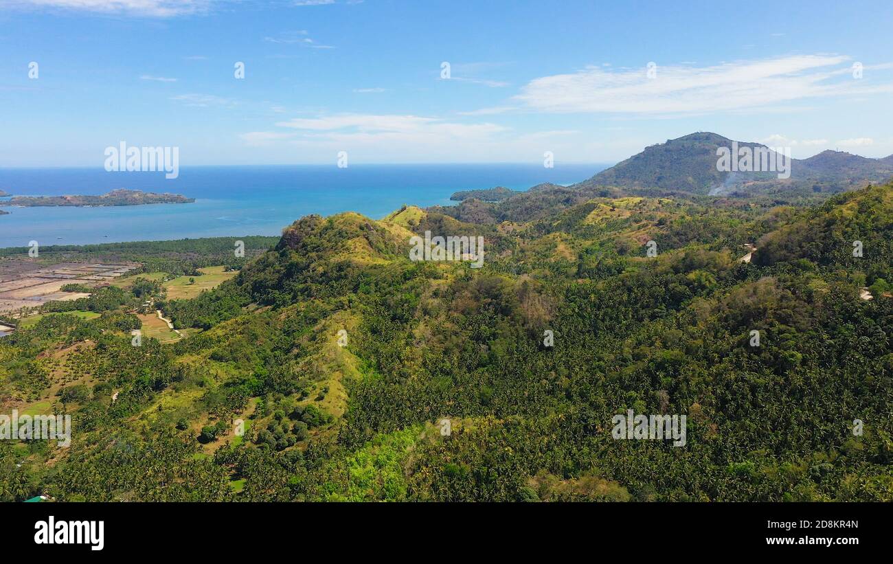 The mountains and hills with tropical forest with blue sea. Tropical ...