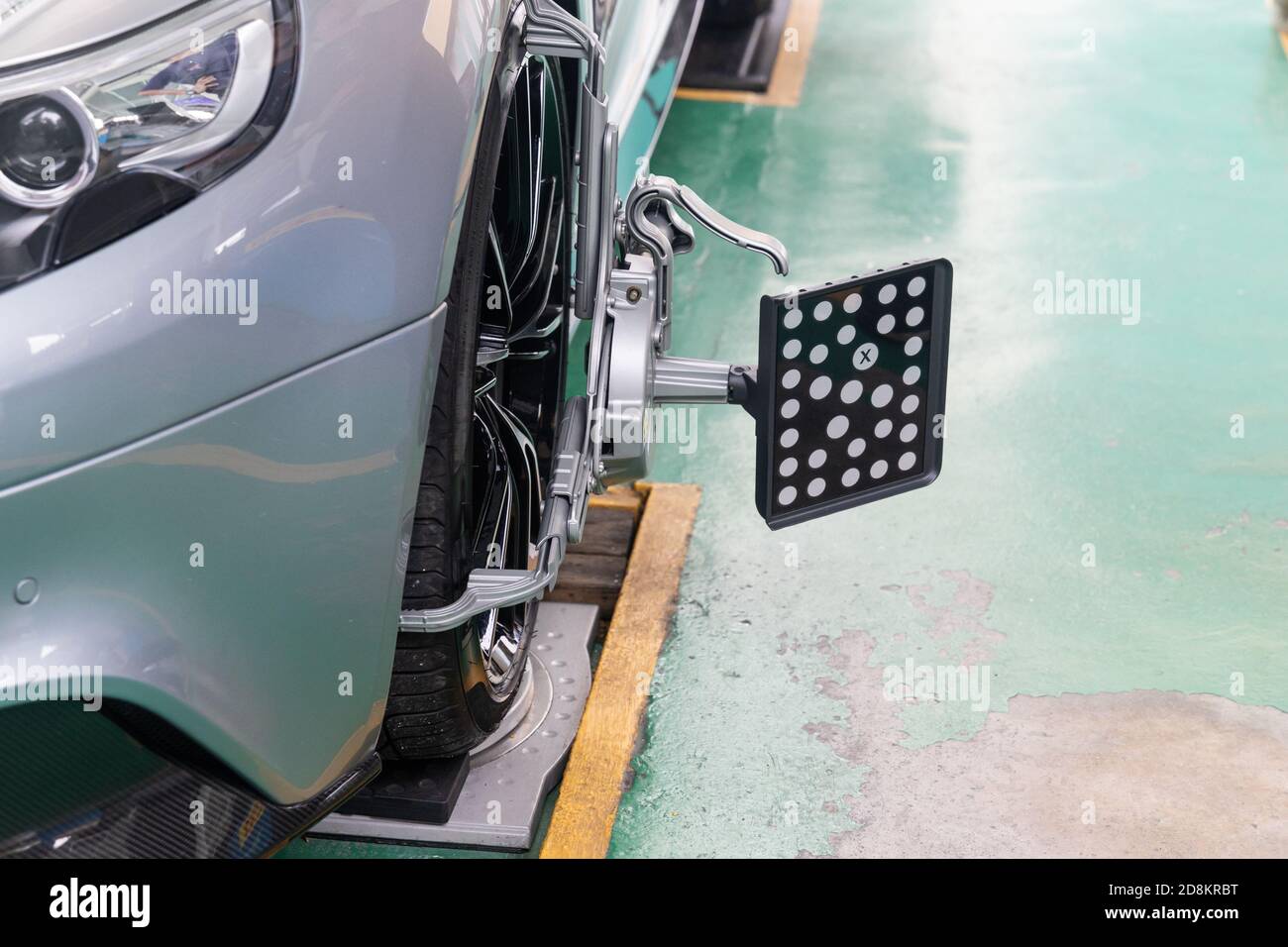 Closeup Car wheel clamp with wheel align device for alignment Stock ...