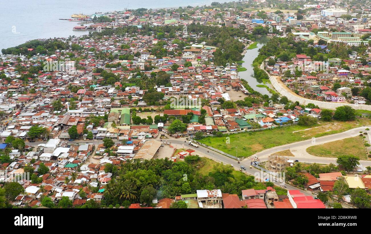Aerial drone of city of Iligan near the sea on the island of Mindanao ...